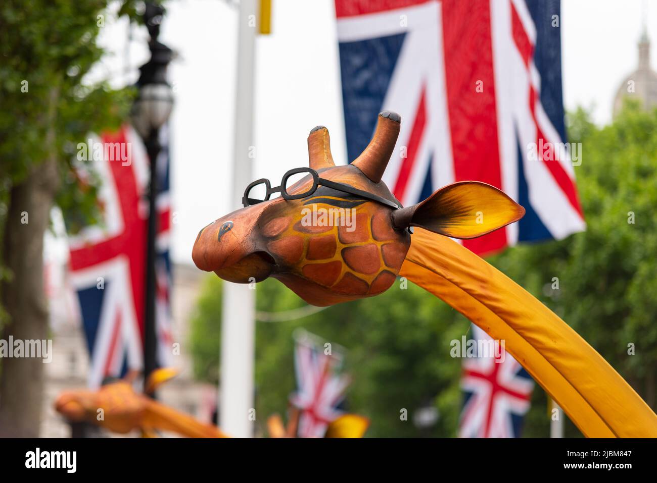 Large giraffe puppet at the Queen's Platinum Jubilee Pageant parade in ...