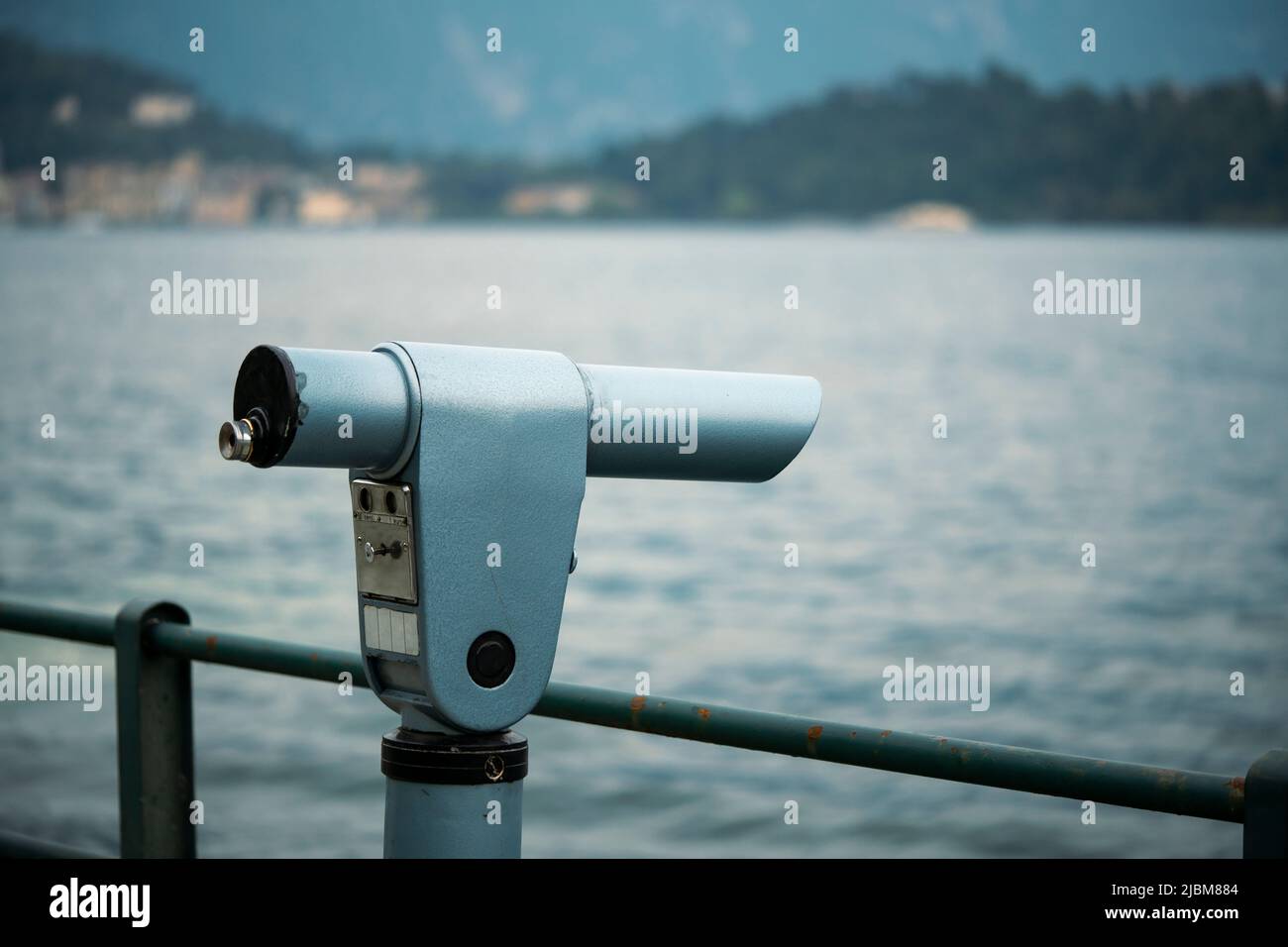 Coin operated monocular on the edge of a lake Stock Photo - Alamy