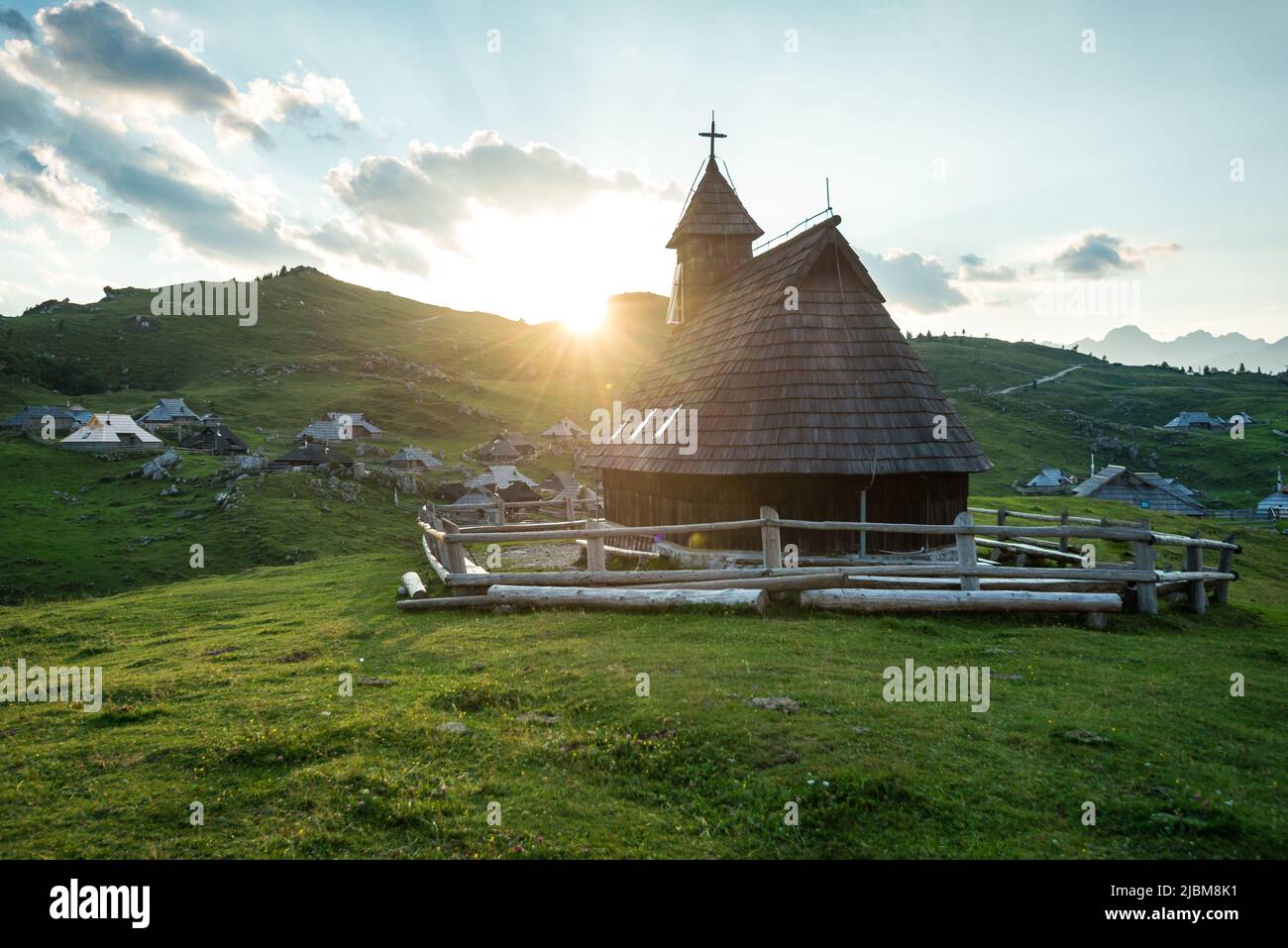 Refreshing golden sun flare featuring wooden church the 'Chapel of Our ...