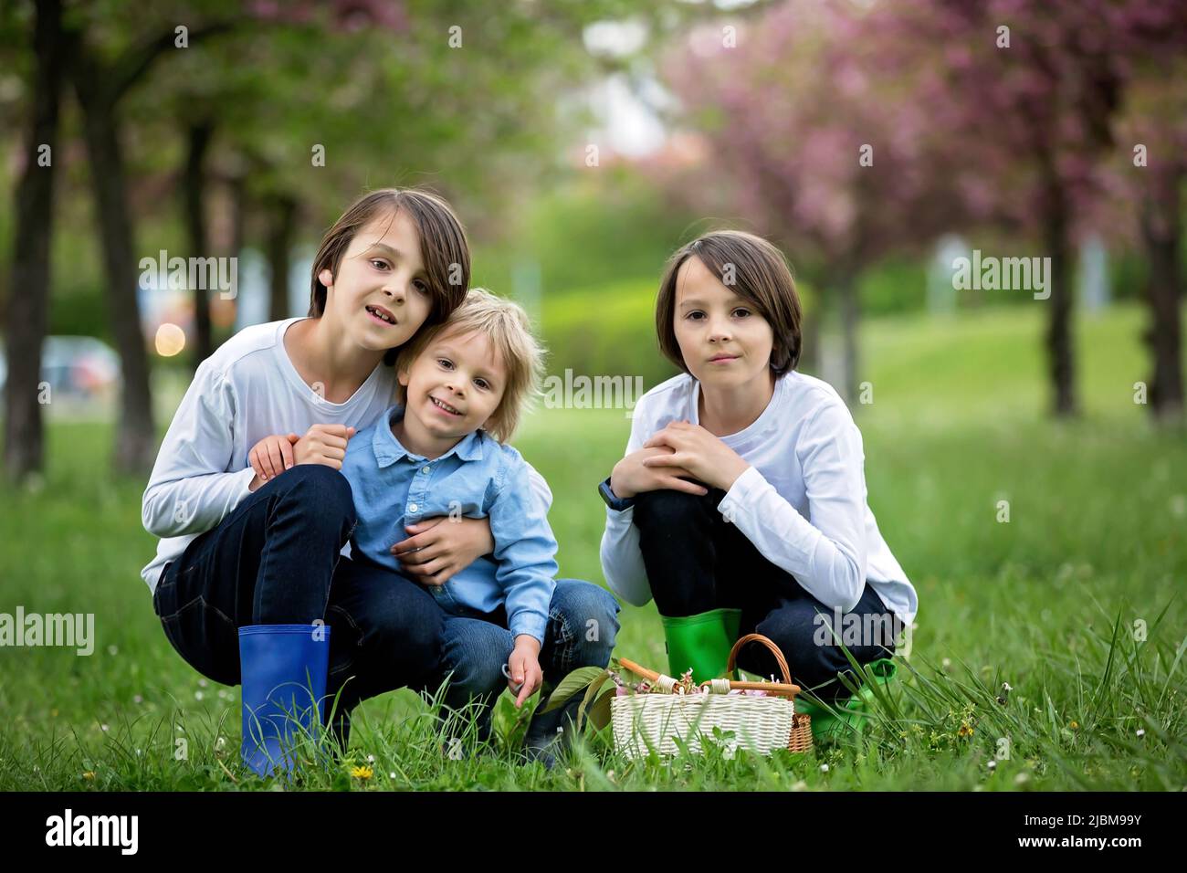 Happy children of different age groups, running together in the park ...