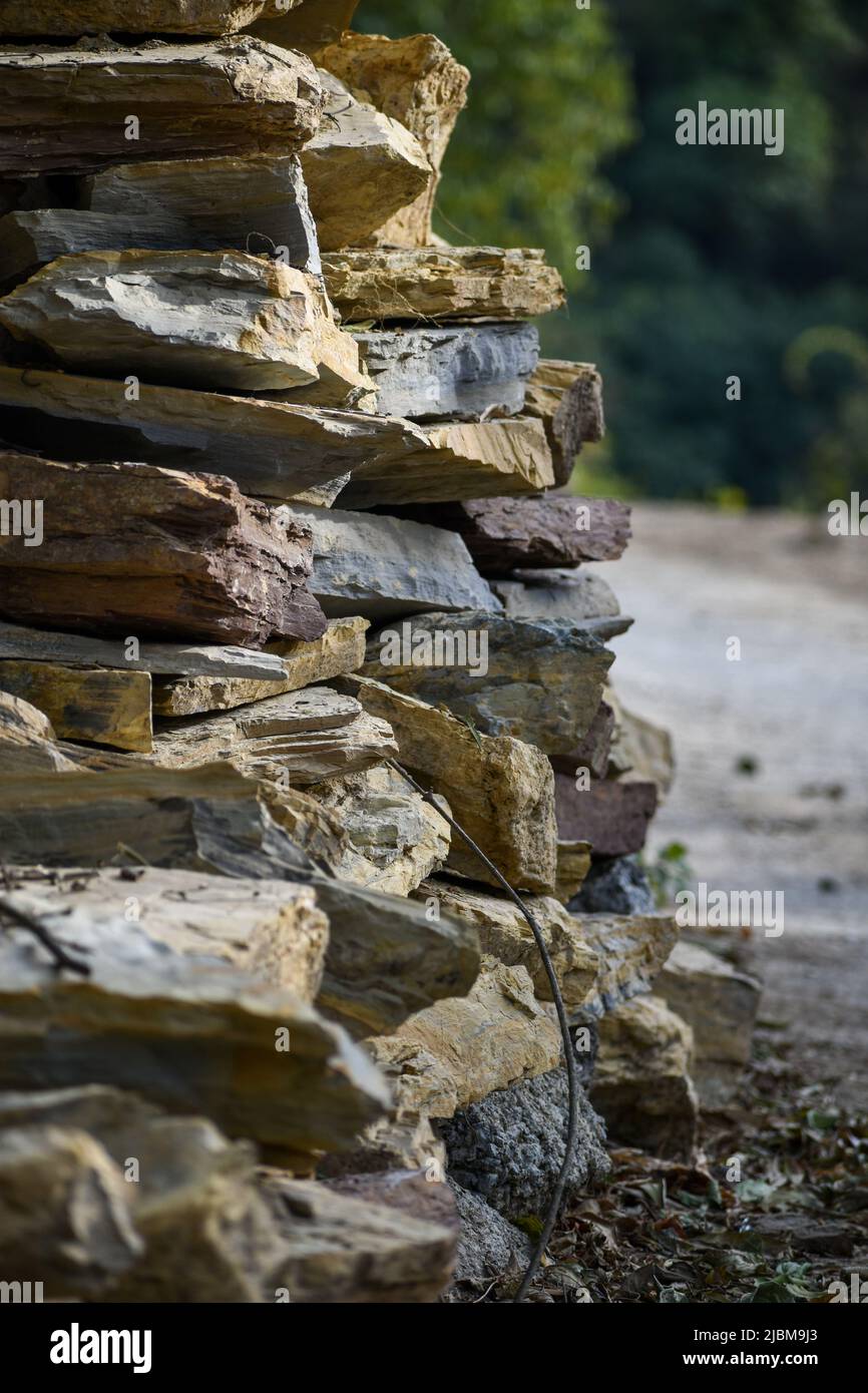 A closeup shot of a roadside step made of natural rocks in rural ...