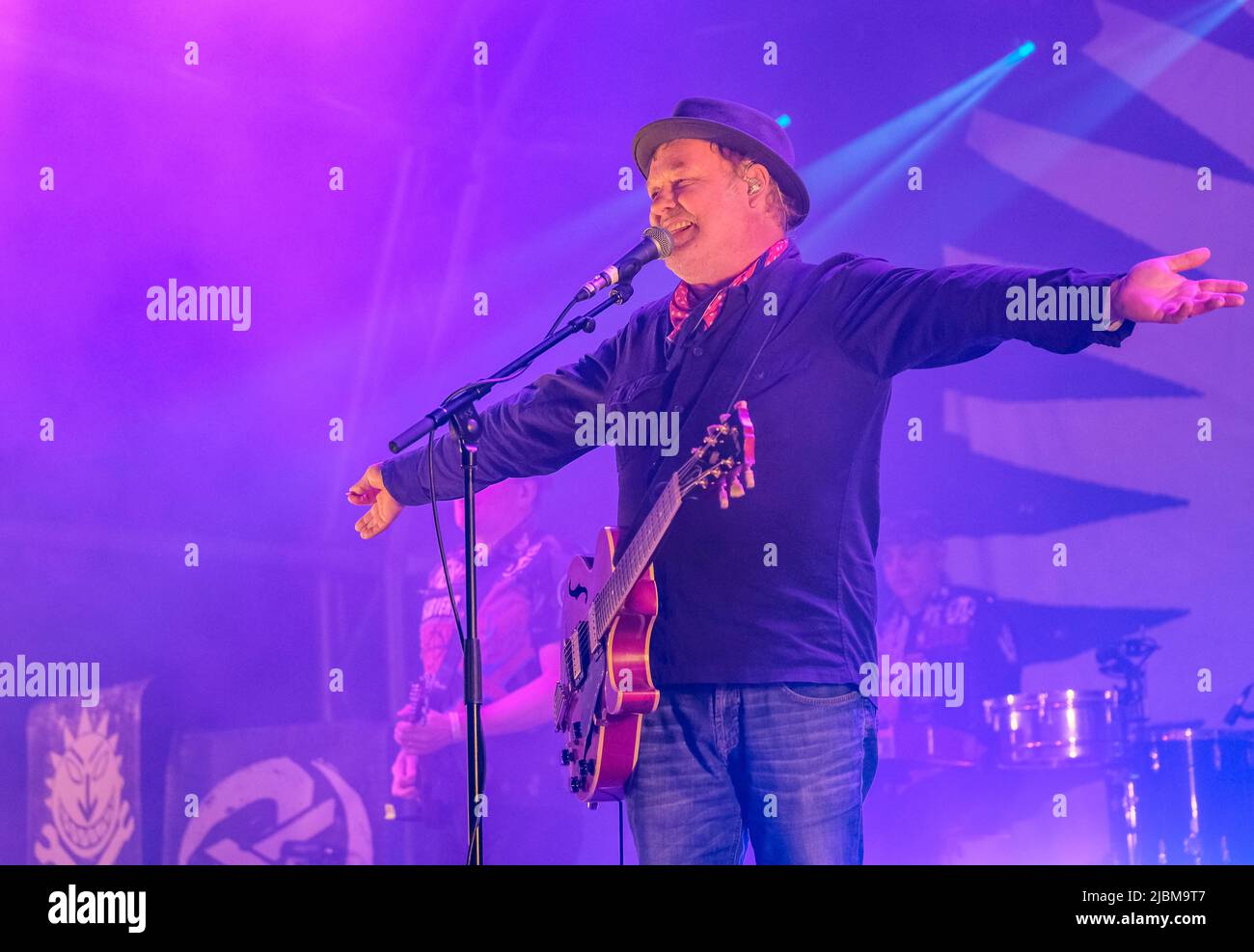 Mark Chadwick of The Levellers performing at Wychwood Festival ...