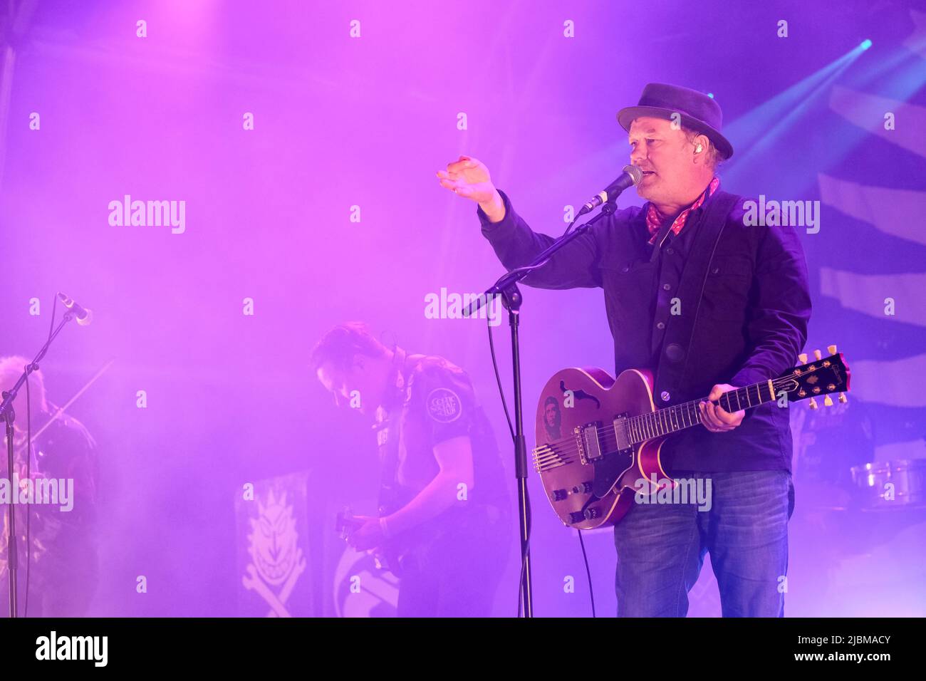 Mark Chadwick of The Levellers performing at Wychwood Festival ...