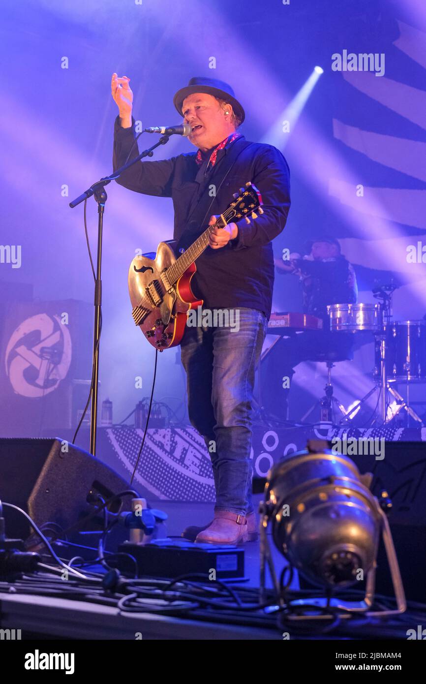 Mark Chadwick of The Levellers performing at Wychwood Festival ...