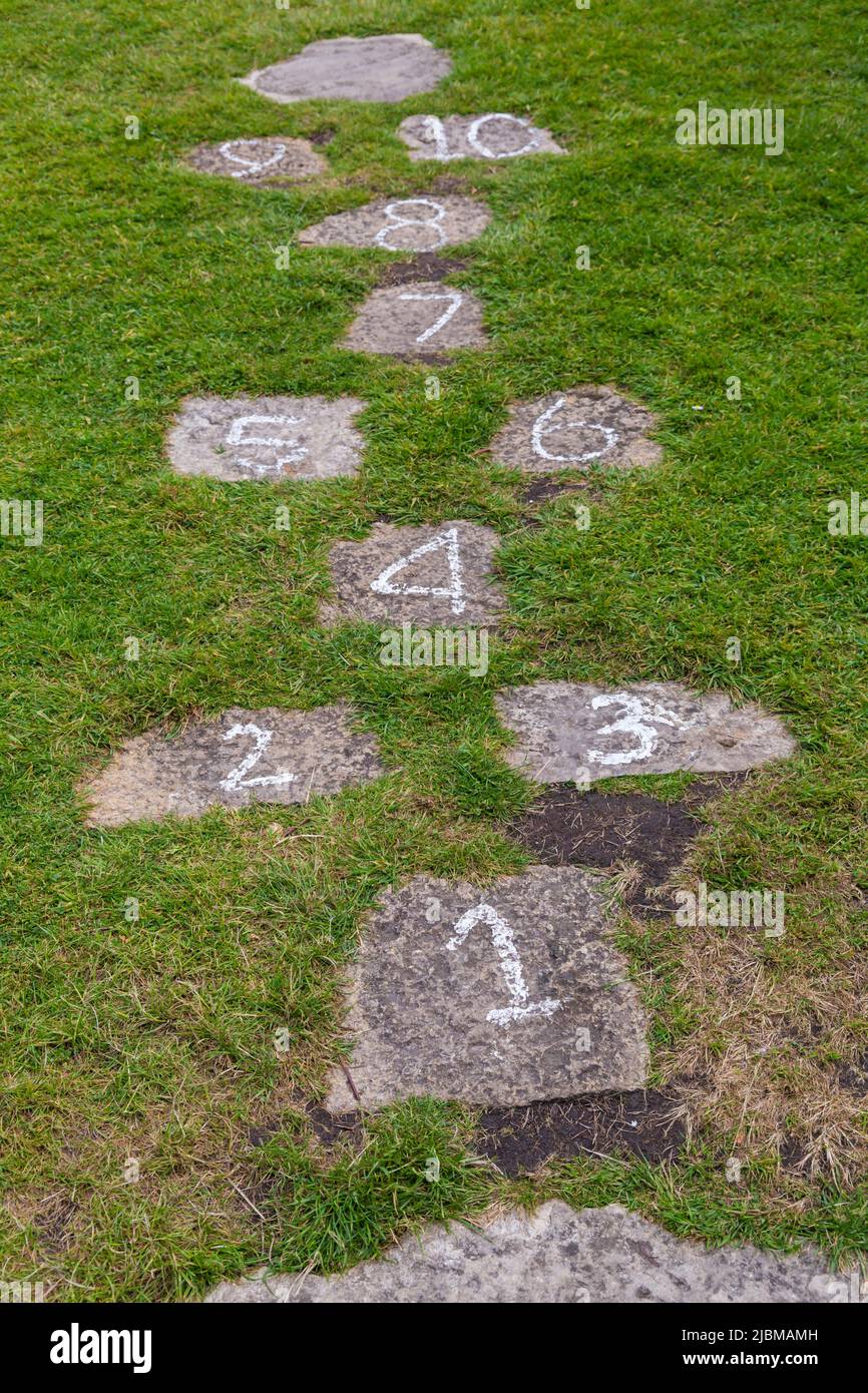 Stones painted for a game of hopscotch at Corfe Castle, Dorset UK in ...