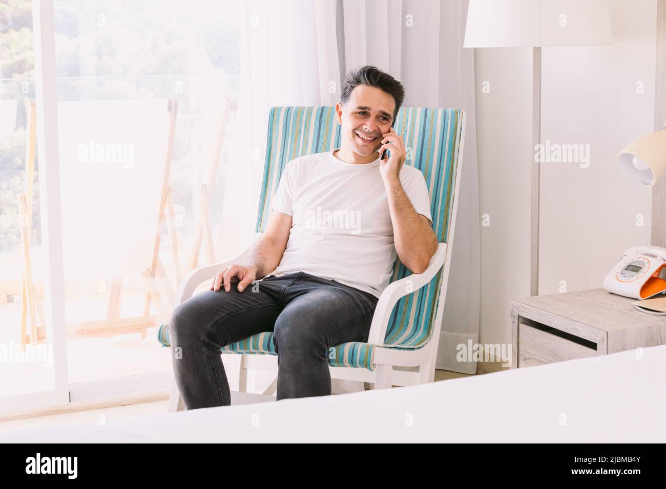 Man in a rocking chair hi-res stock photography and images - Alamy