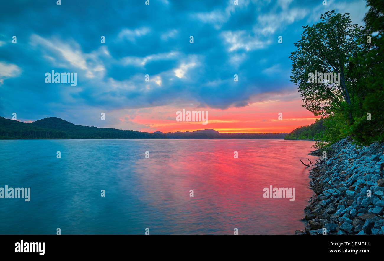 Dramatic colorful sunset along the shoreline of Cave Run Lake, KY Stock ...