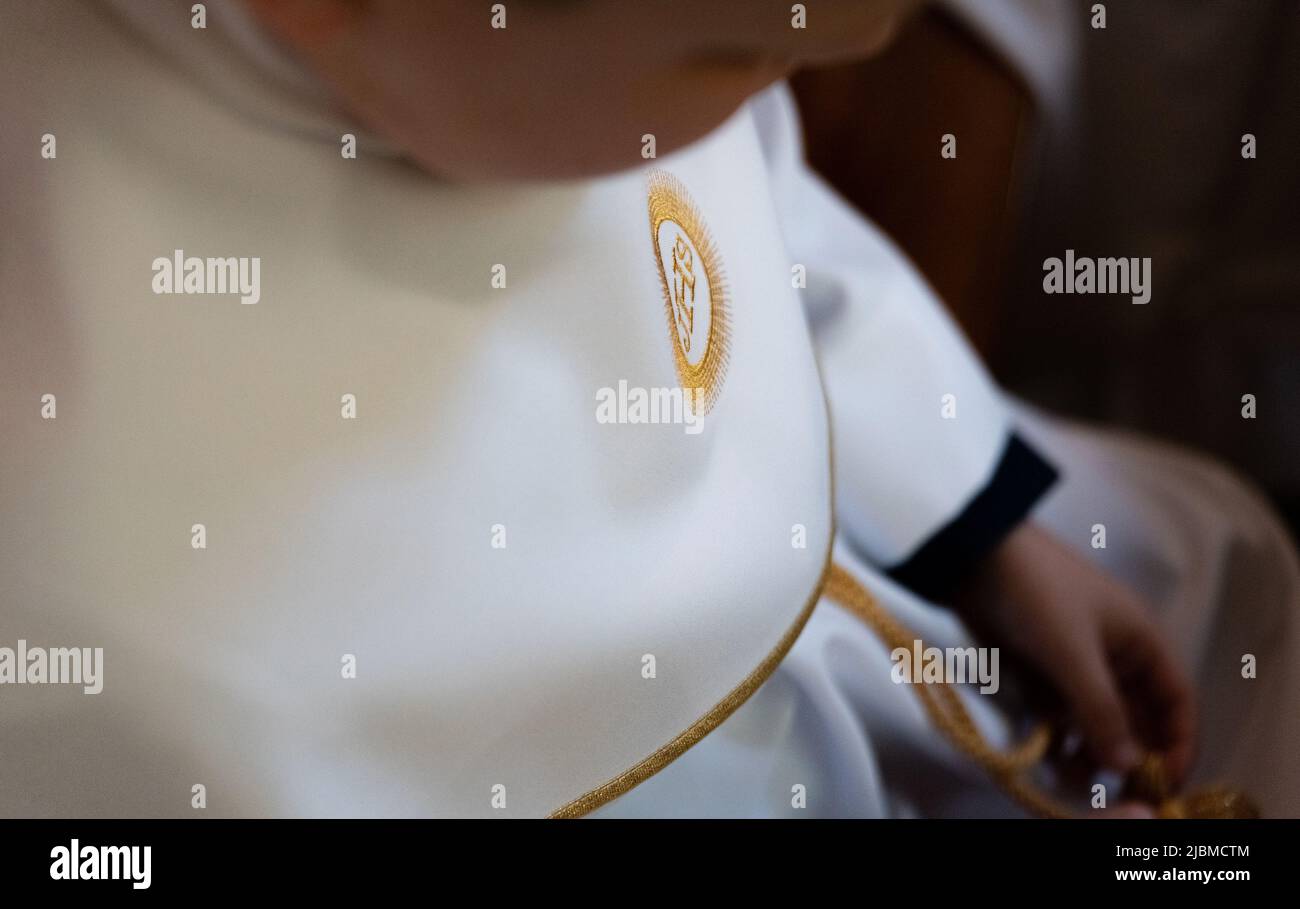 IHS Christian symbol on a communion child. IHS Christogram embroidered ...