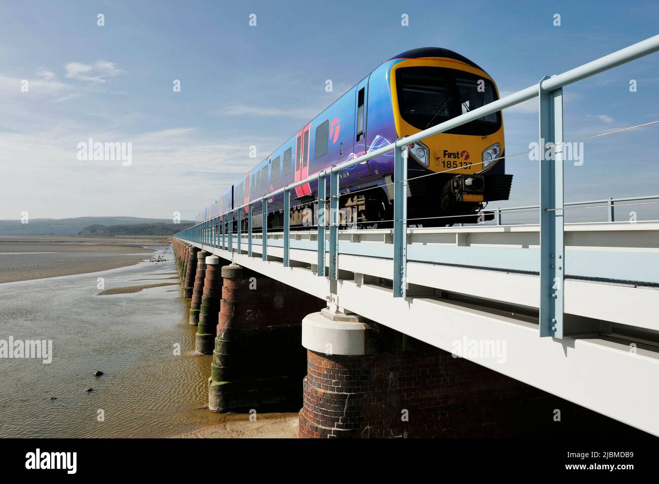 A First Rail train crossing the Kent Viaduct in the village of Arnside ...