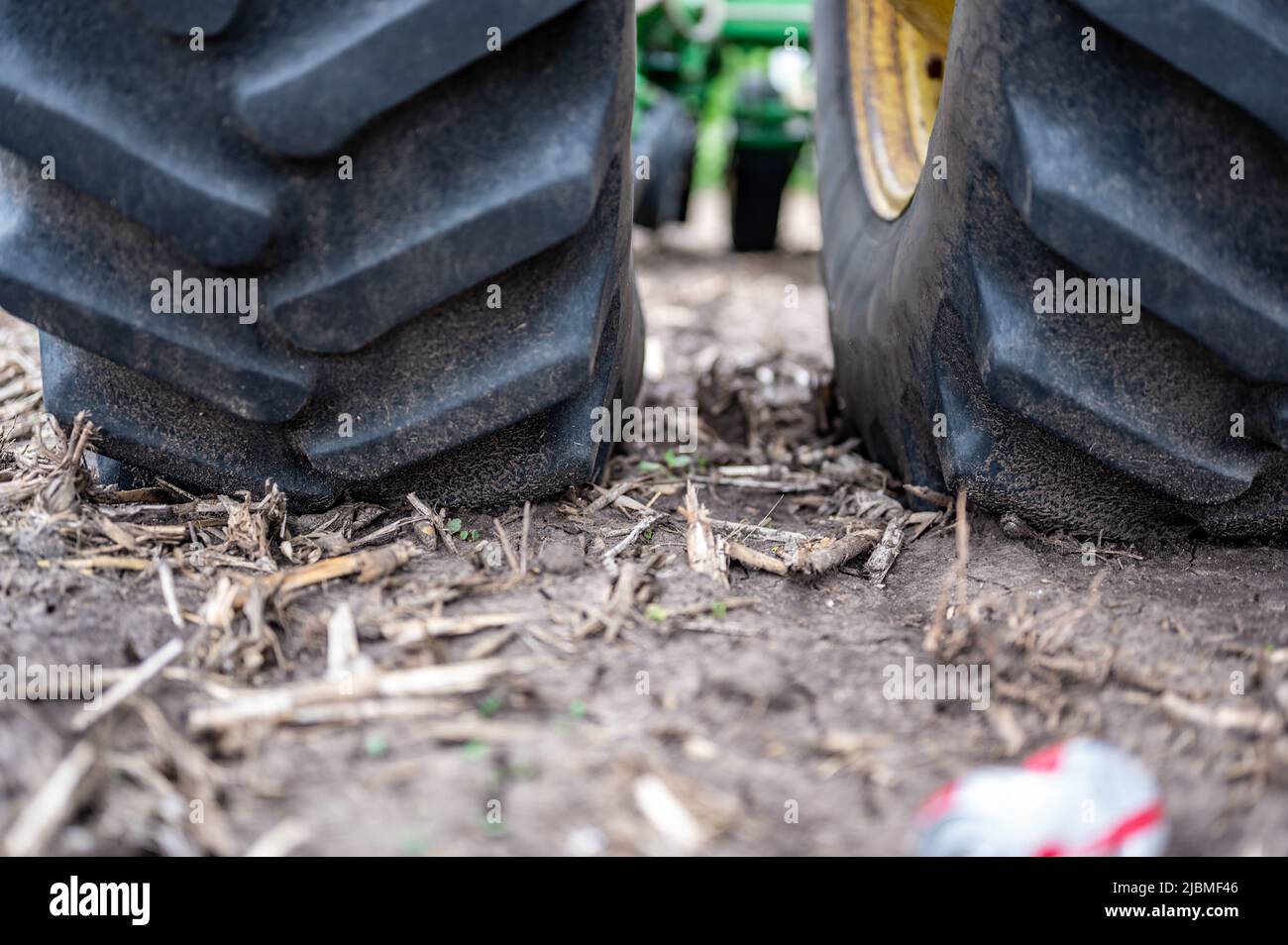 Soil compaction caused by a dual tractor tires over topsoil dirt in an ...