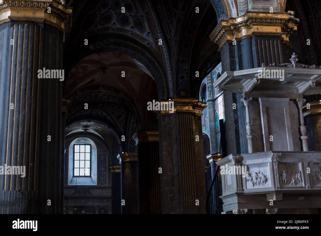 beautiful columns with an arched ceiling and large windows in an old ...