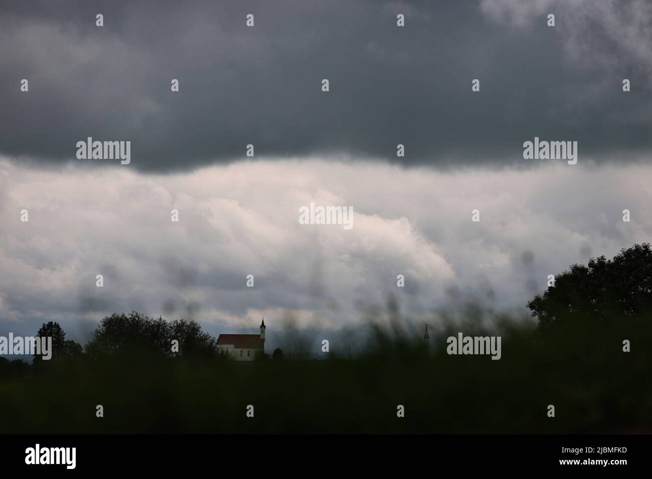 Aitrang, Germany. 07th June, 2022. Clouds drift over the pilgrimage ...