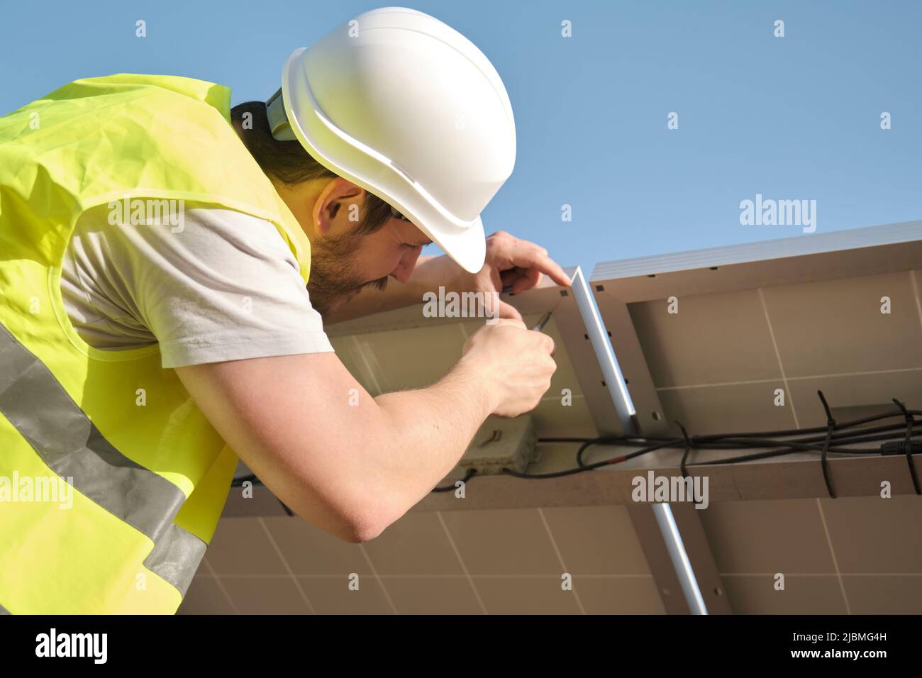 Young technician installing solar photovoltaic panel station Stock ...