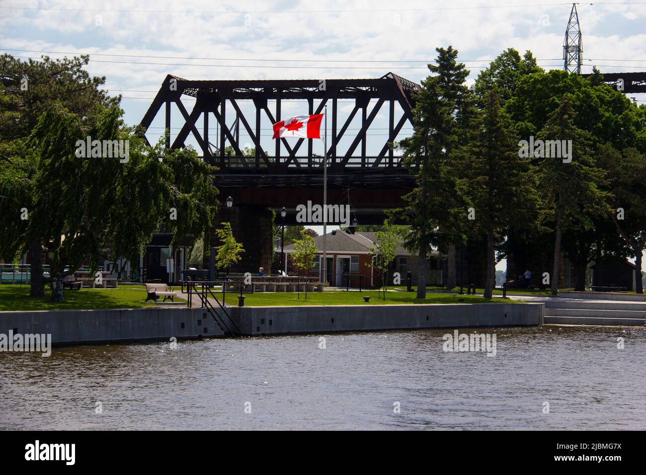 Rail bridge at a waterfront park Stock Photo - Alamy