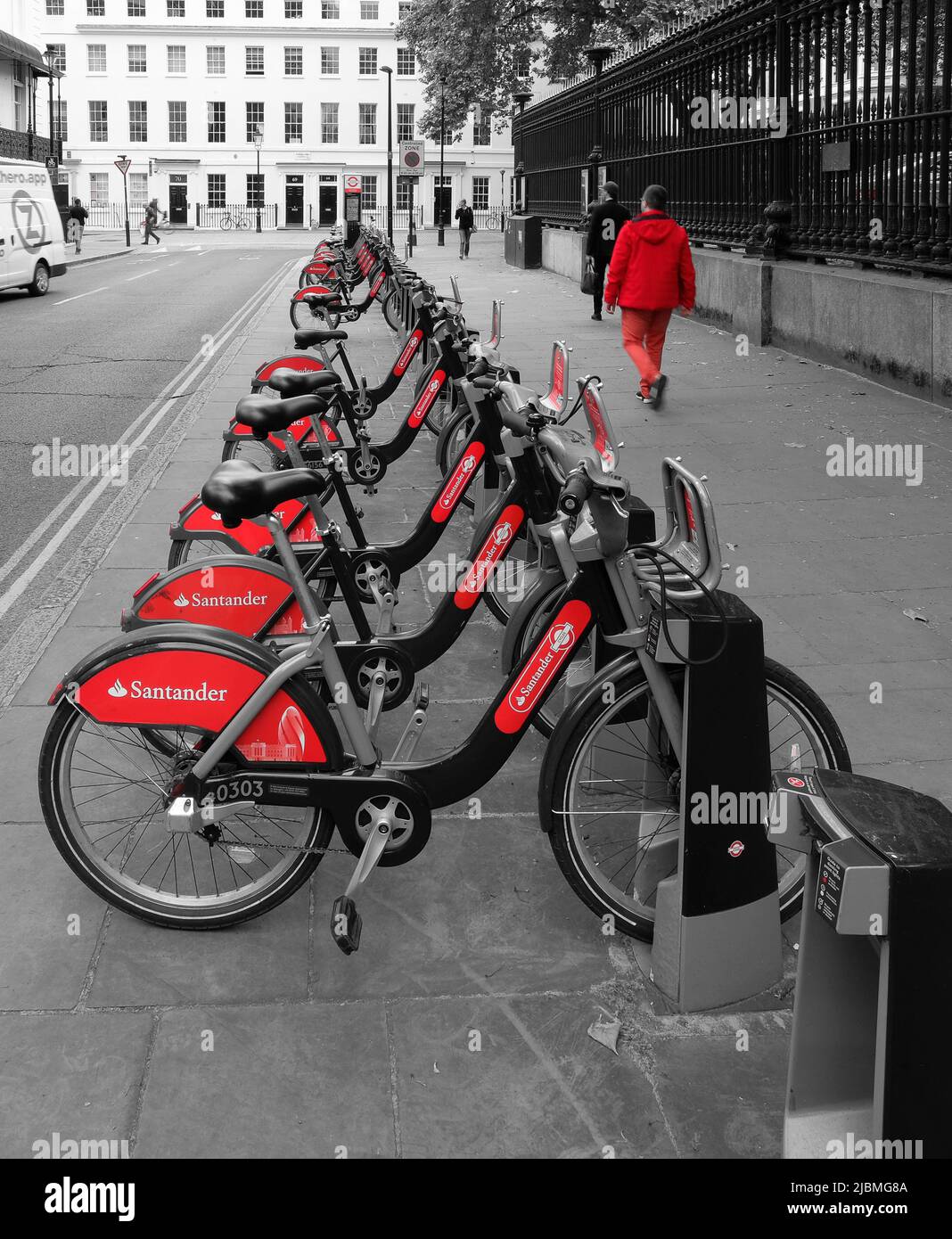 Red London Santander bikes in a row - red study with passerby Stock ...