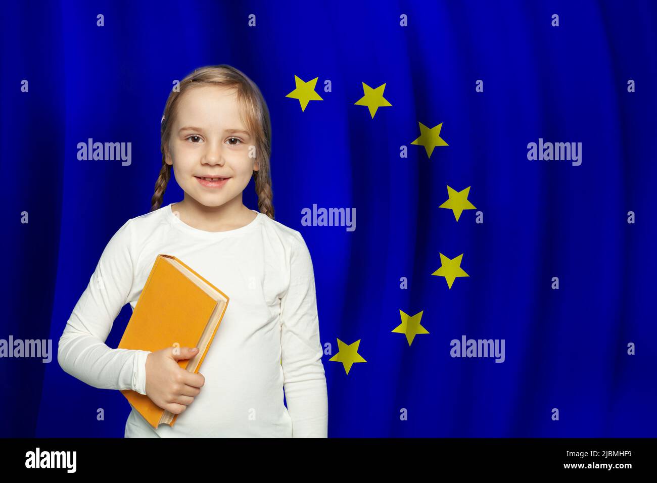 Education and school in European Union concept. Cheerful child girl ...