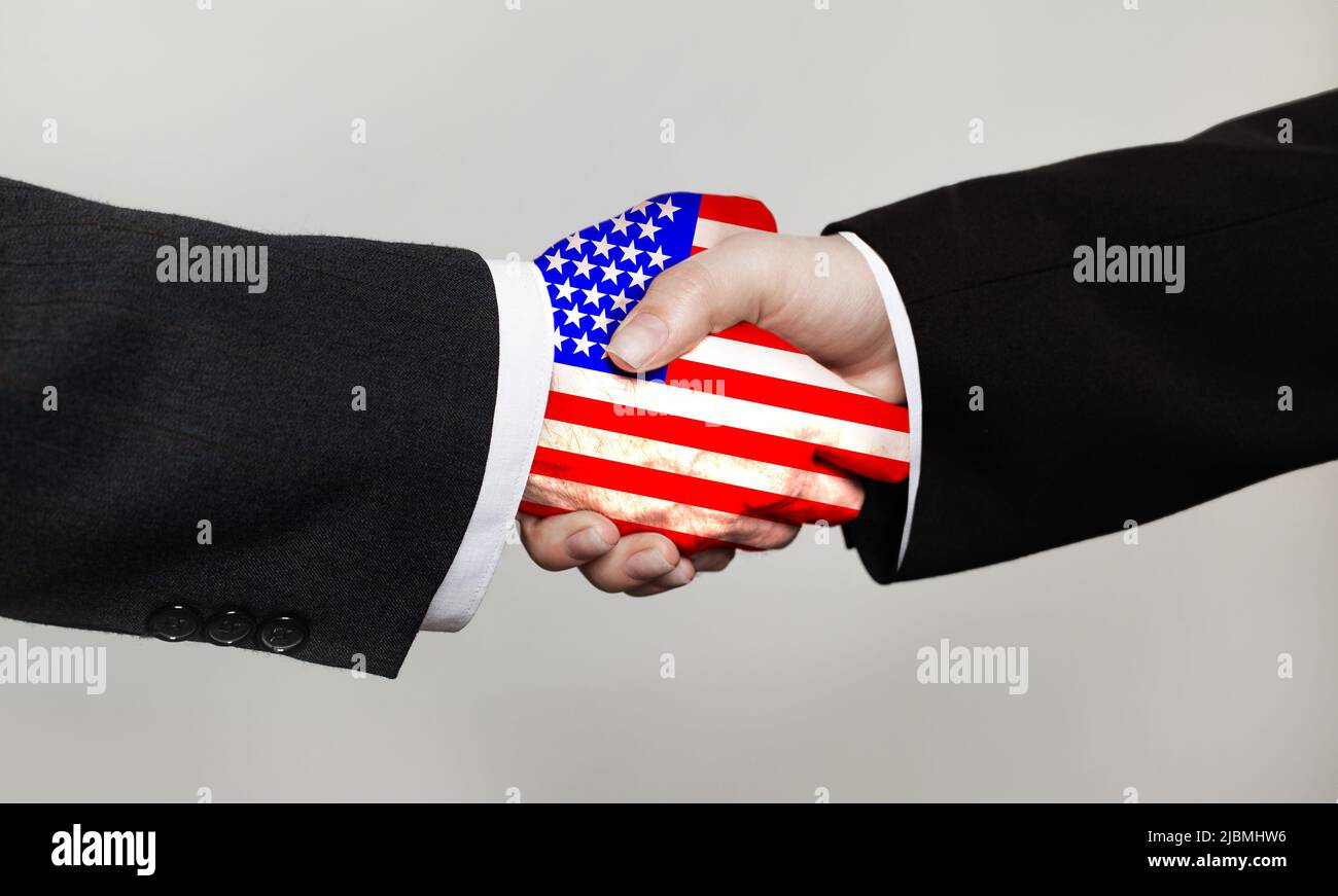 USA cooperation and business with handshake. Male handshake with the ...