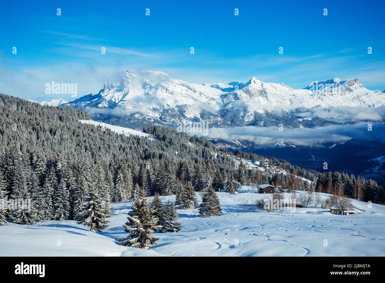Winter alpine landscape with off-piste snowboard and ski tracks Stock ...
