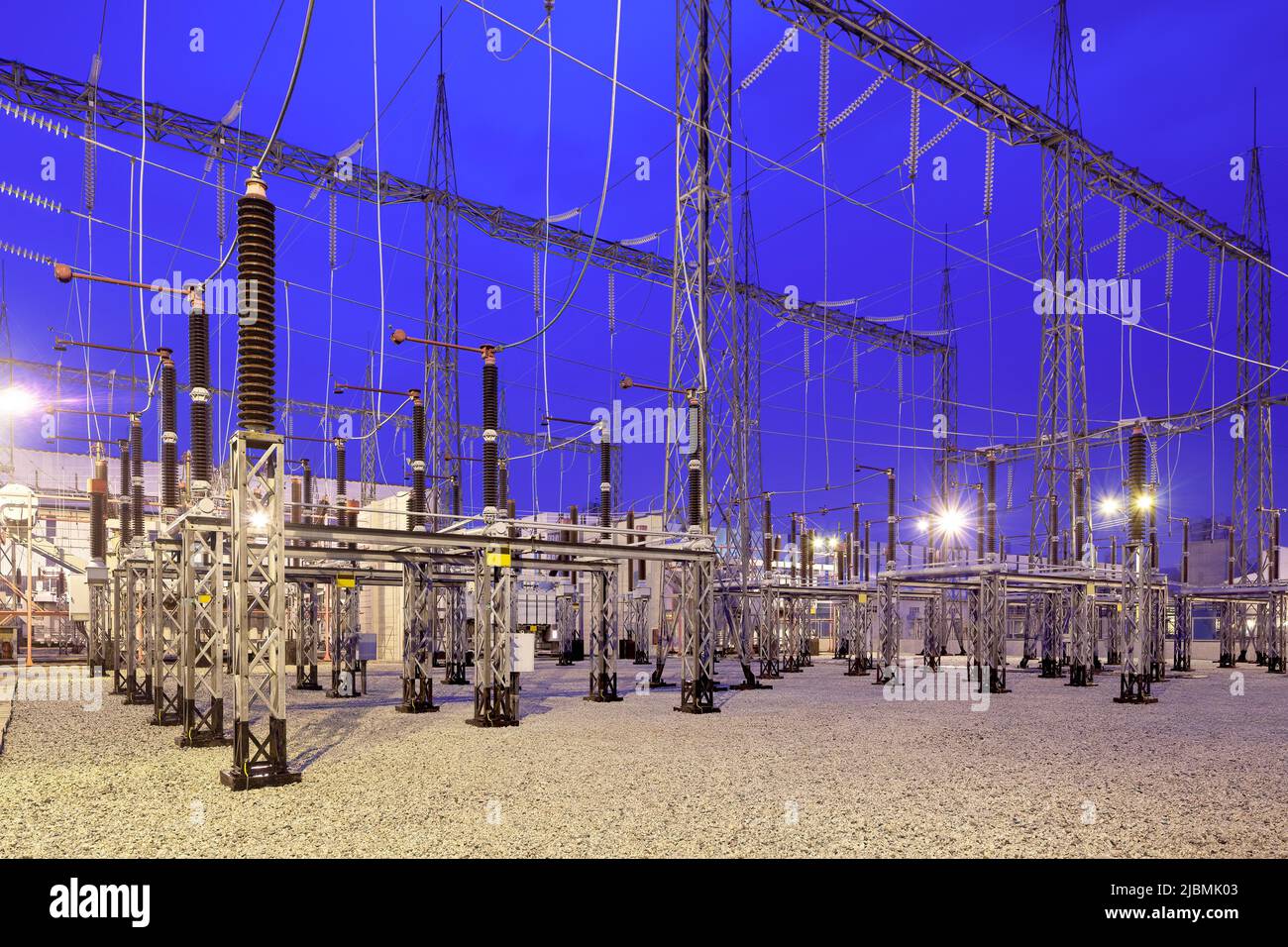 Illuminated electricity substation at dusk Stock Photo - Alamy