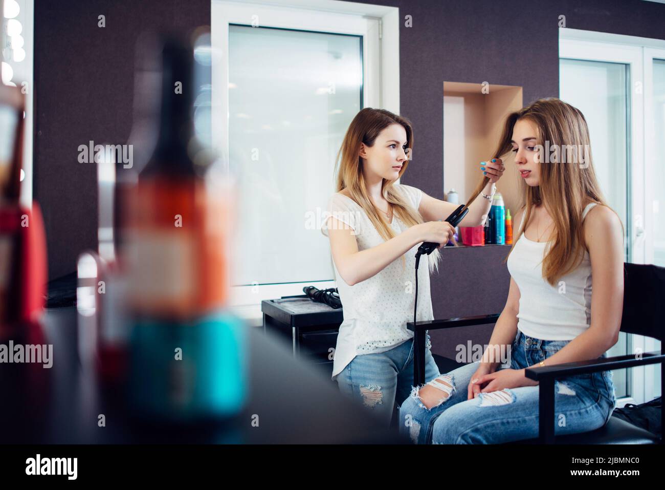 Straightening hair hi-res stock photography and images - Alamy