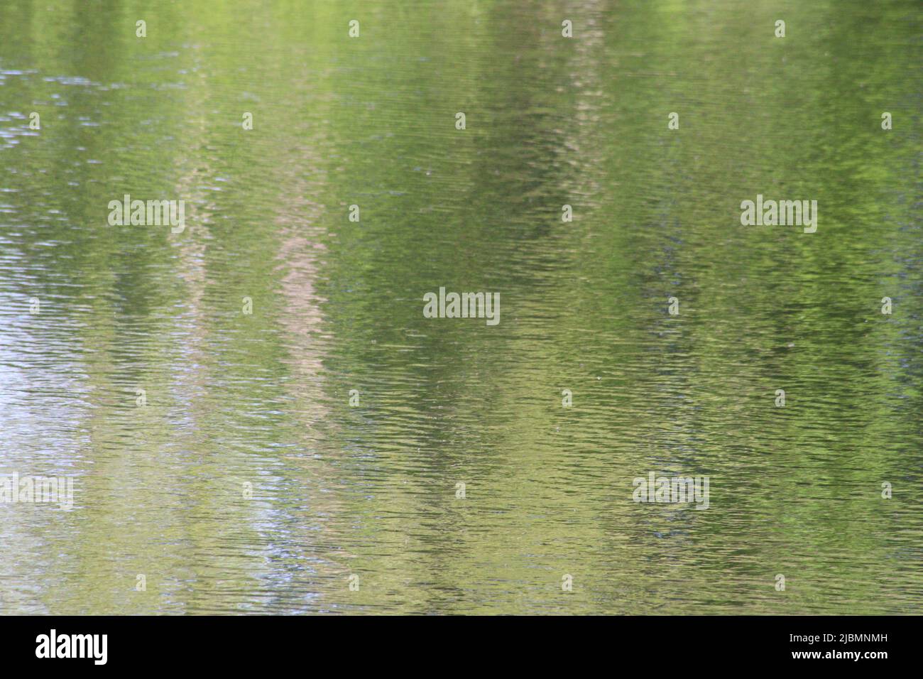 Colours reflected in pond Stock Photo - Alamy