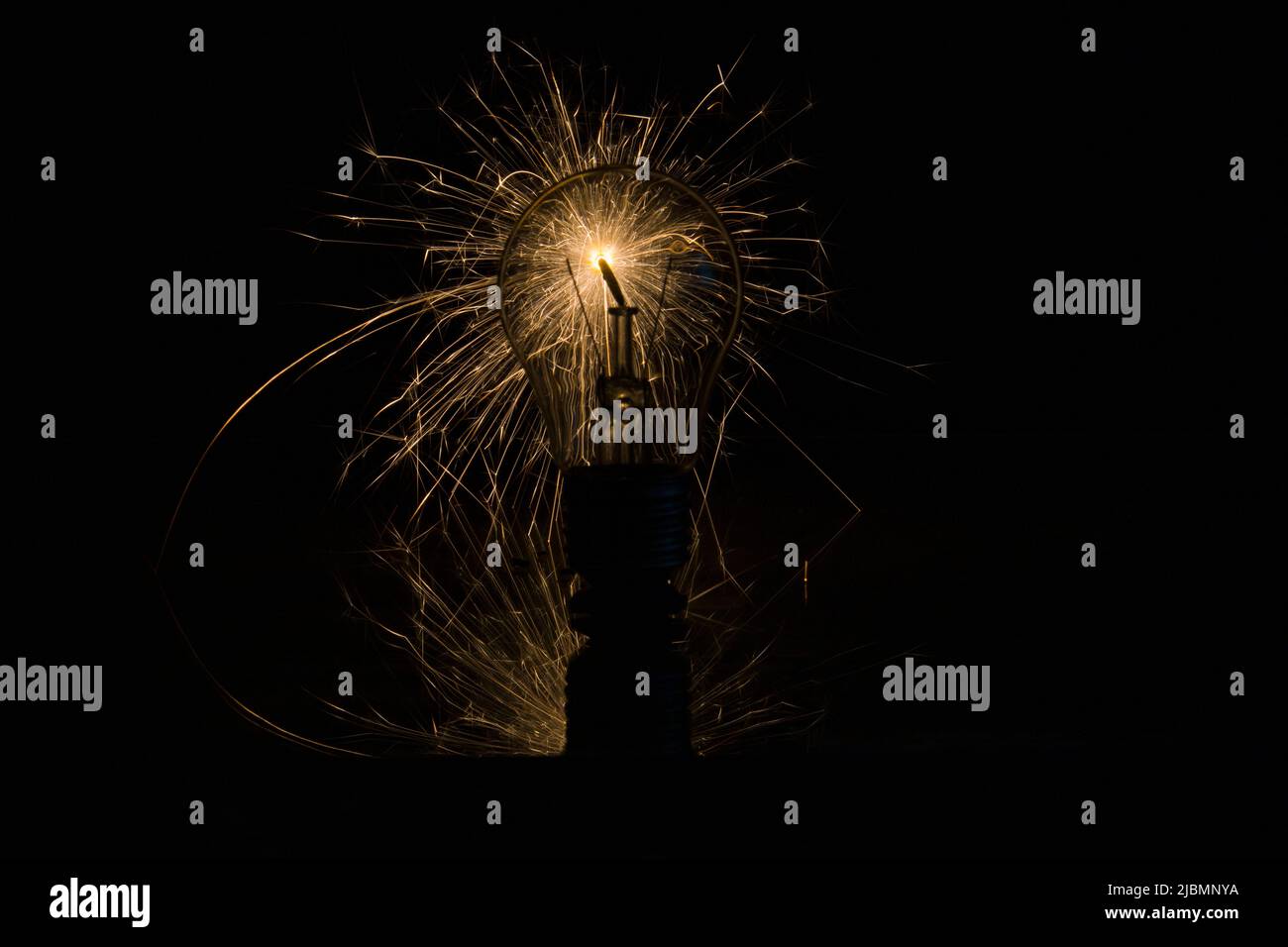 The incandescent lamp burns with sparks Stock Photo - Alamy