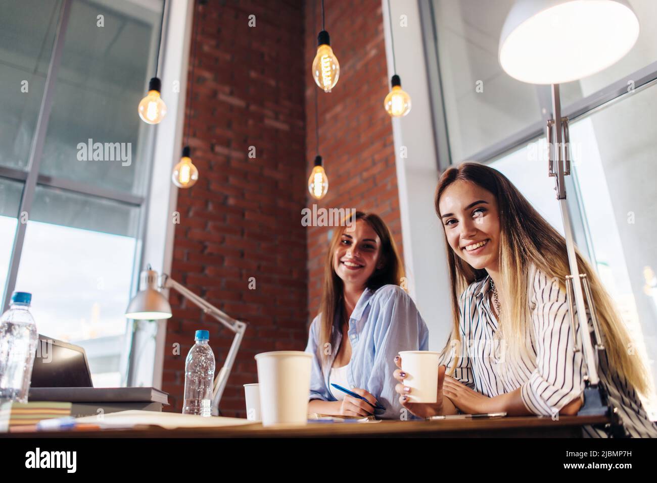 Three students discussing hi-res stock photography and images - Alamy