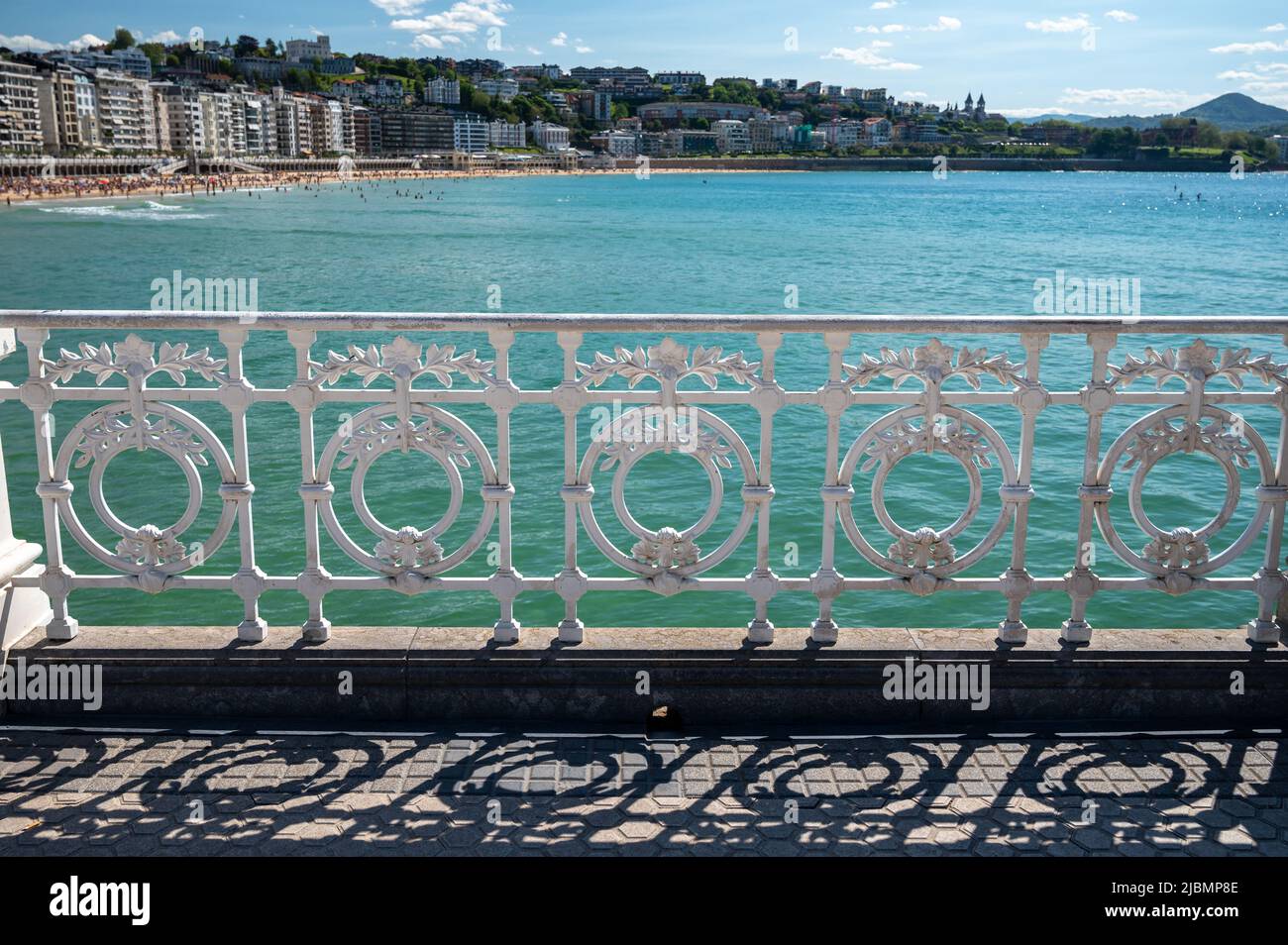 Walking near La Concha white sandy beach in San Sebastian or Donostia ...