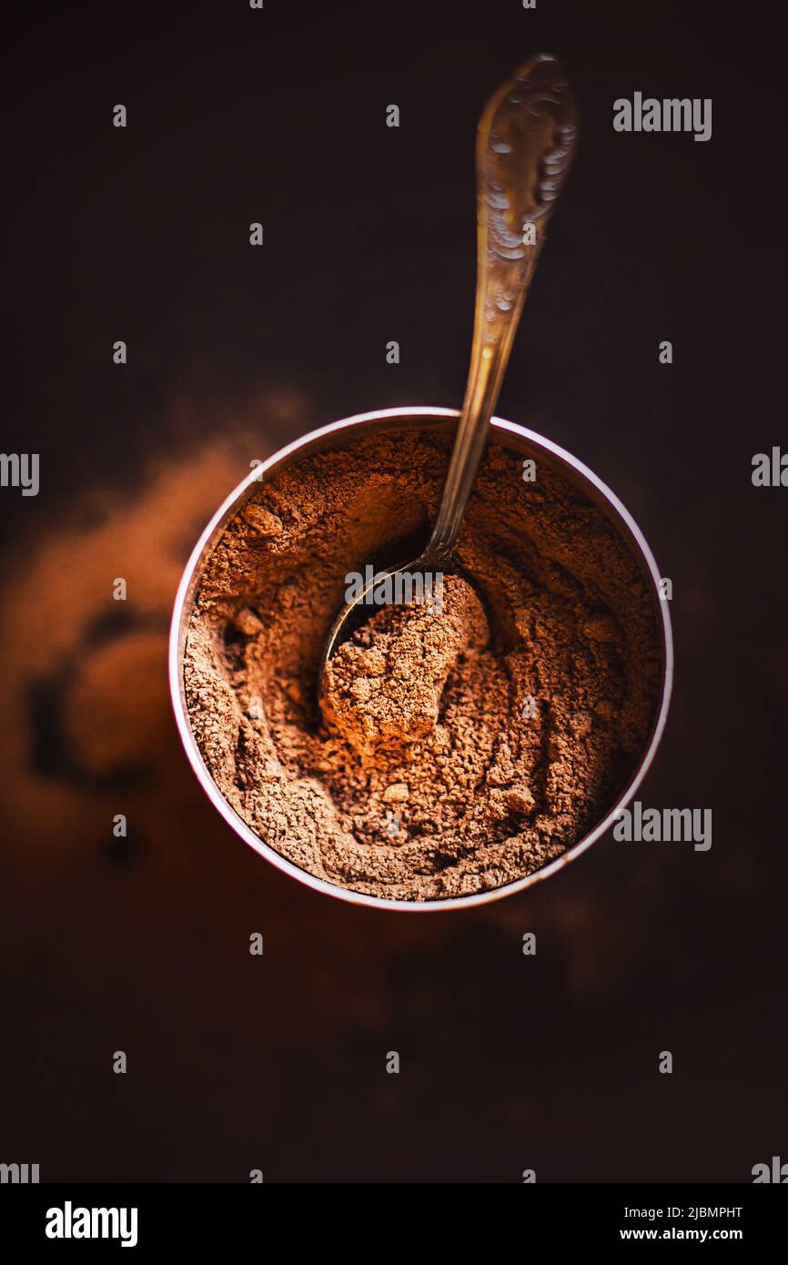 Top view of a jar filled with fragrant natural cocoa powder, which ...