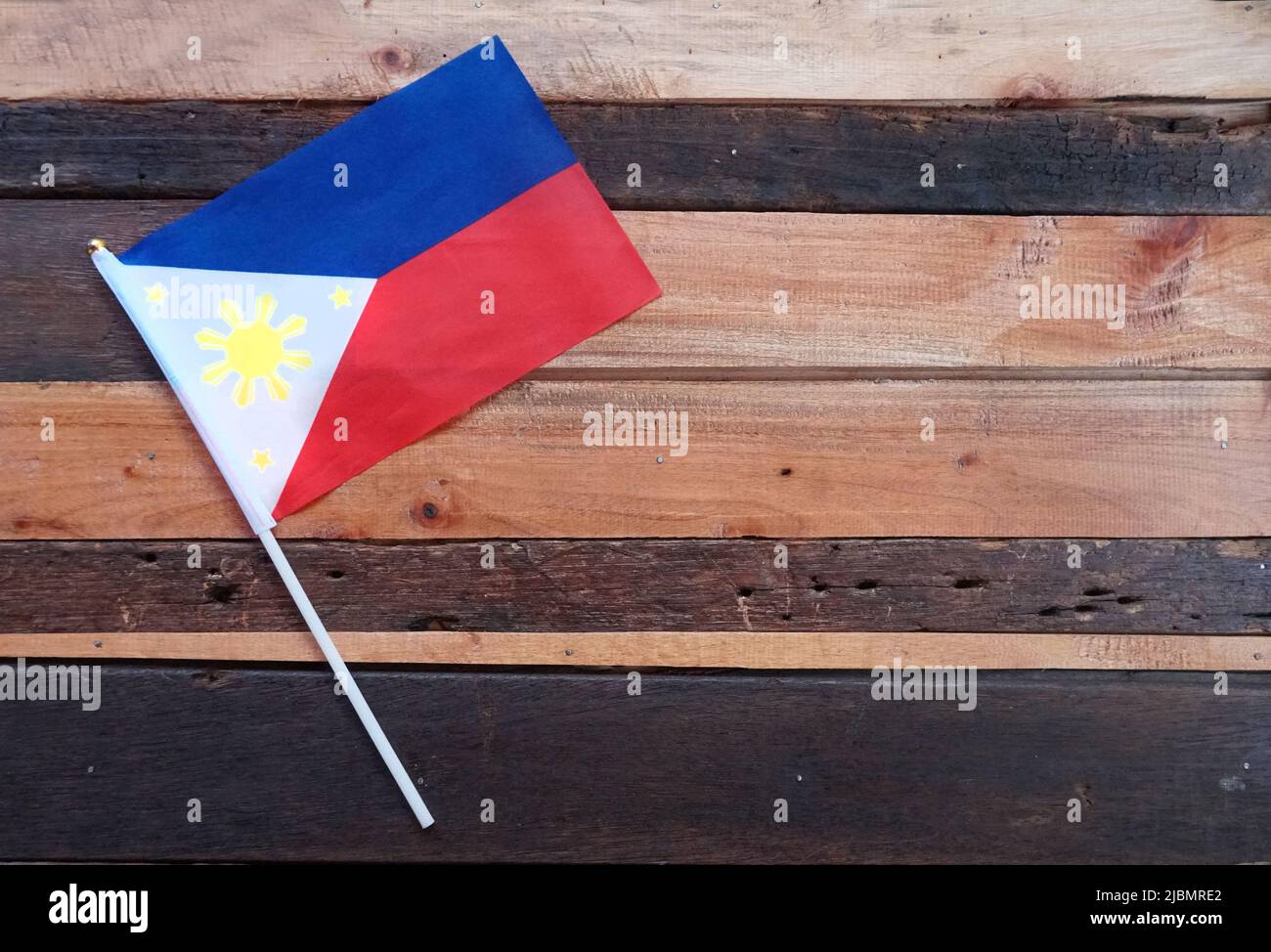 Philippine flag on a wooden rustic table background Stock Photo - Alamy