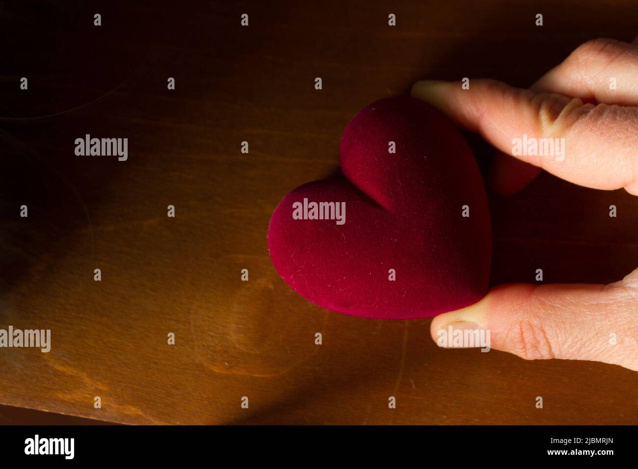 Gift box on wooden backround. Marriage proposal concept Stock Photo - Alamy