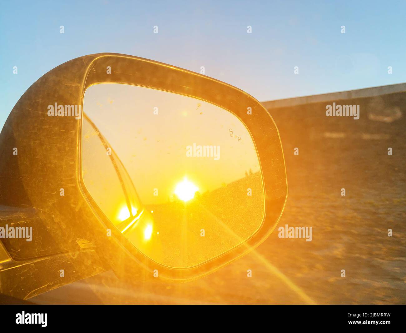 Sun reflection in side mirror of a car Stock Photo - Alamy