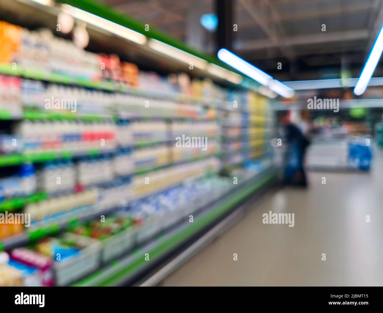 Grocery store blur bokeh background - shoppers at grocery store with ...