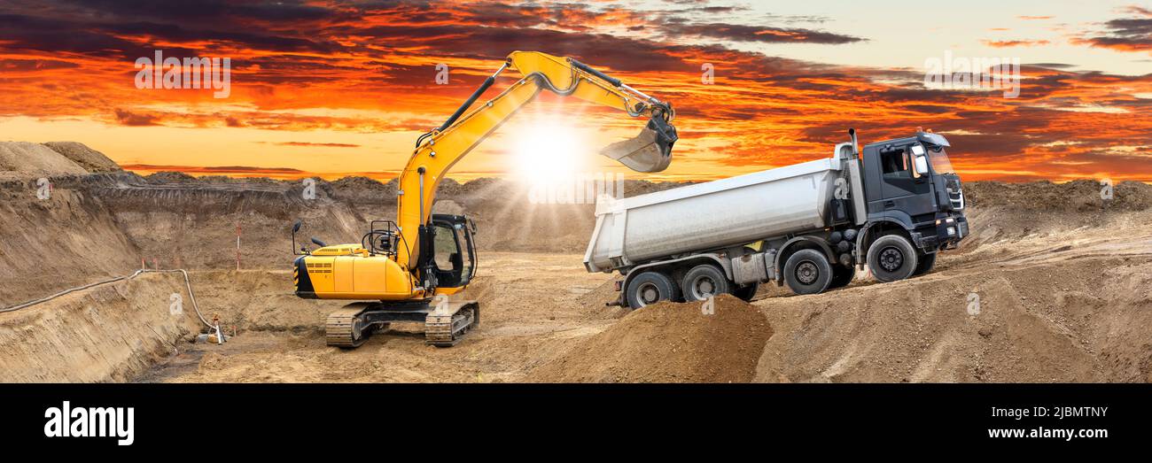 excavator is digging on construction site Stock Photo - Alamy