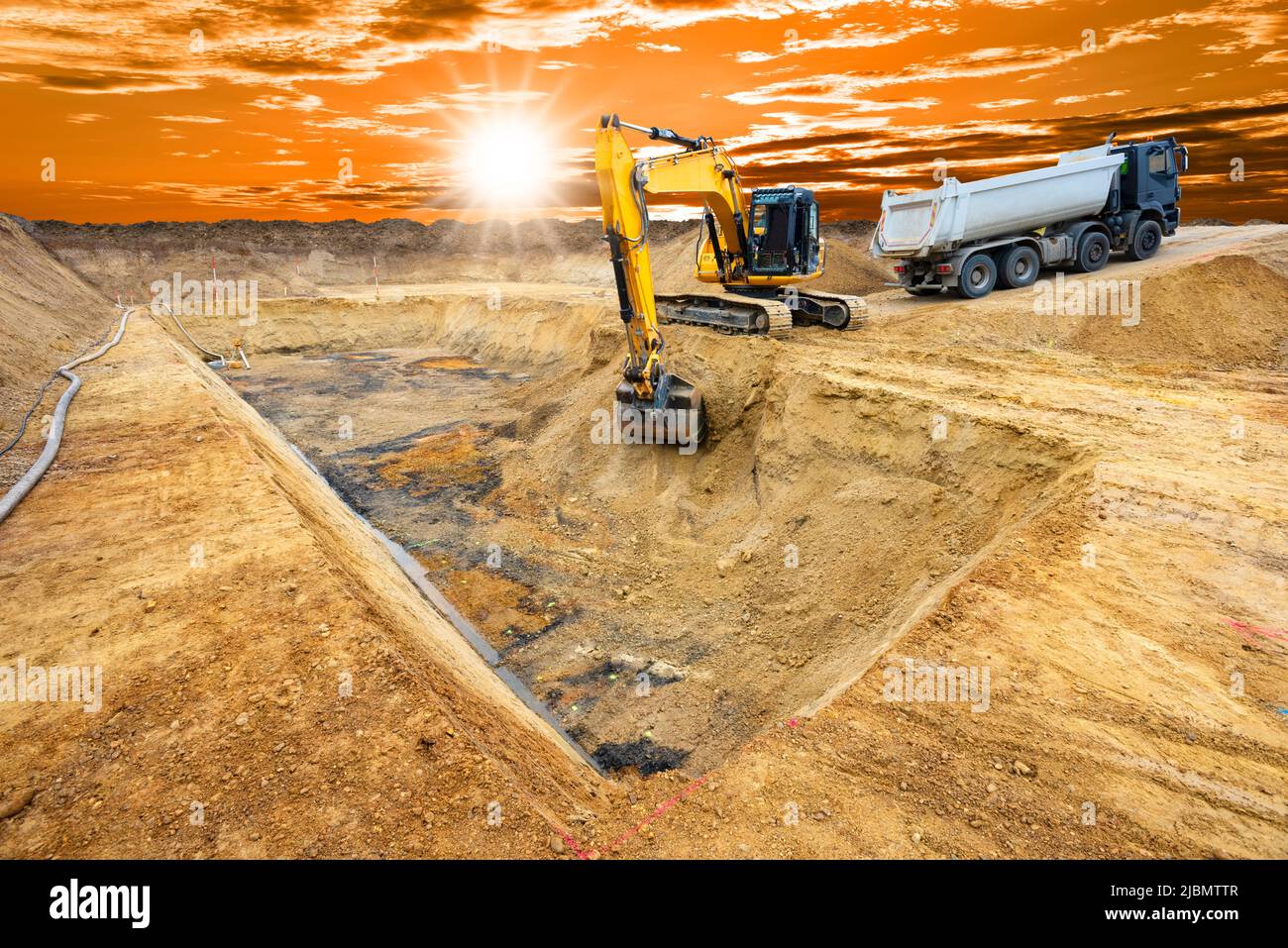 excavator is digging on construction site Stock Photo - Alamy