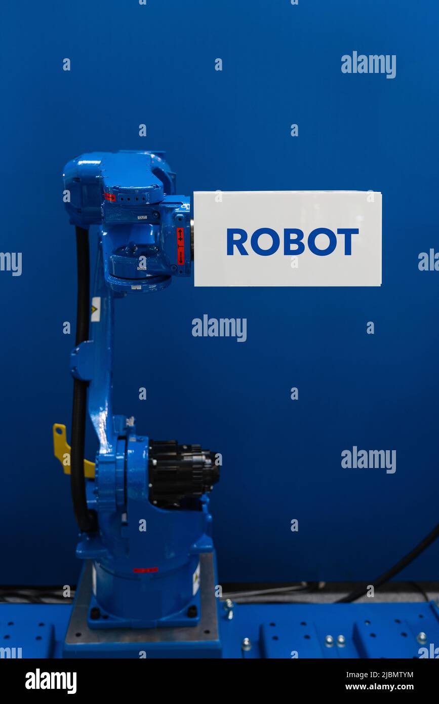 Robot arm with box and text ROBOT. Smart industry concept Stock Photo ...