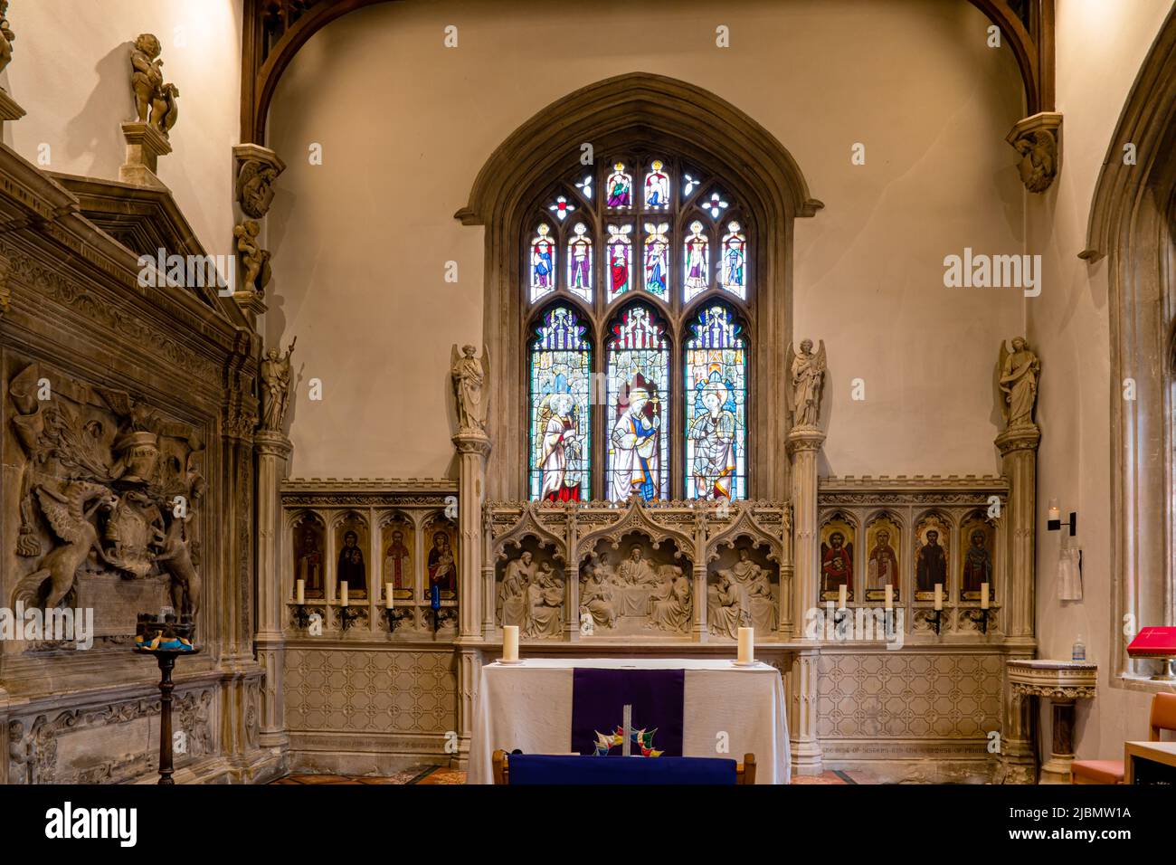 Chancel and altar of Launde Abbey chapel with stained glass window and ...