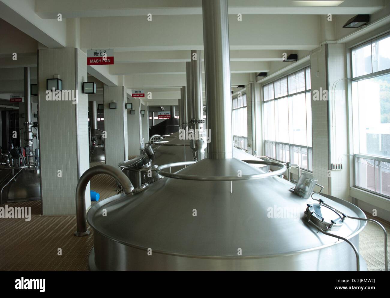 Large fermenting tanks at the Kirin Beer Brewery in Okayama, Honshu ...