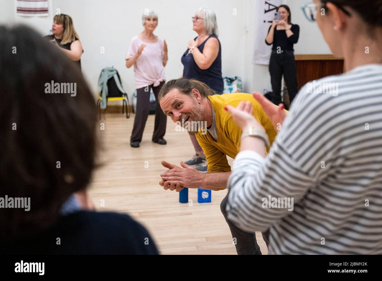 London, UK. 7 June 2022. Music leader Algy Behrens (C) instructs ...