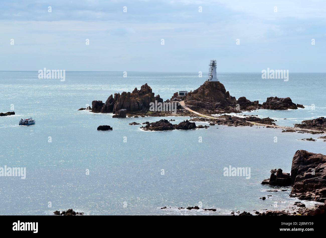 Jersey, La Corbiere lighthouse - accessible via a narrow promontory ...