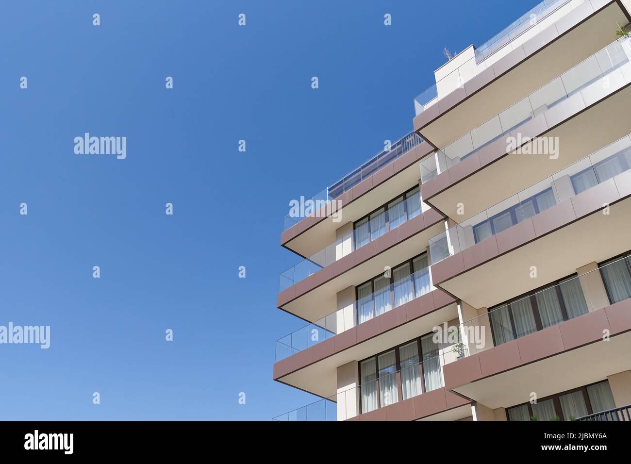 Glass balconies in a luxury modern apartment building Stock Photo - Alamy