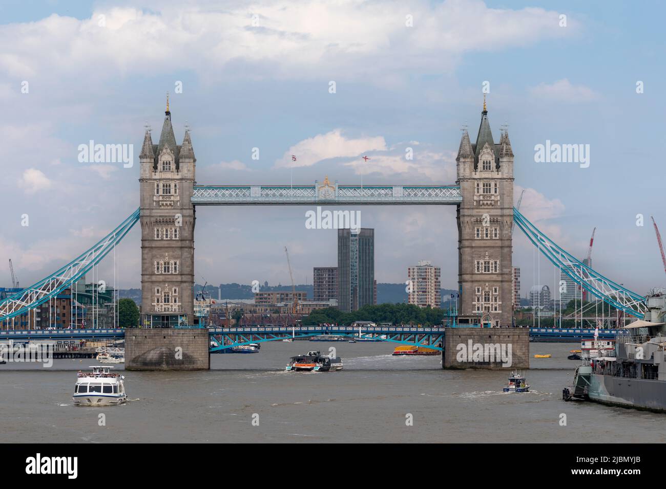 Tower Bridge over the River Thames London. Fast boat coming towards ...