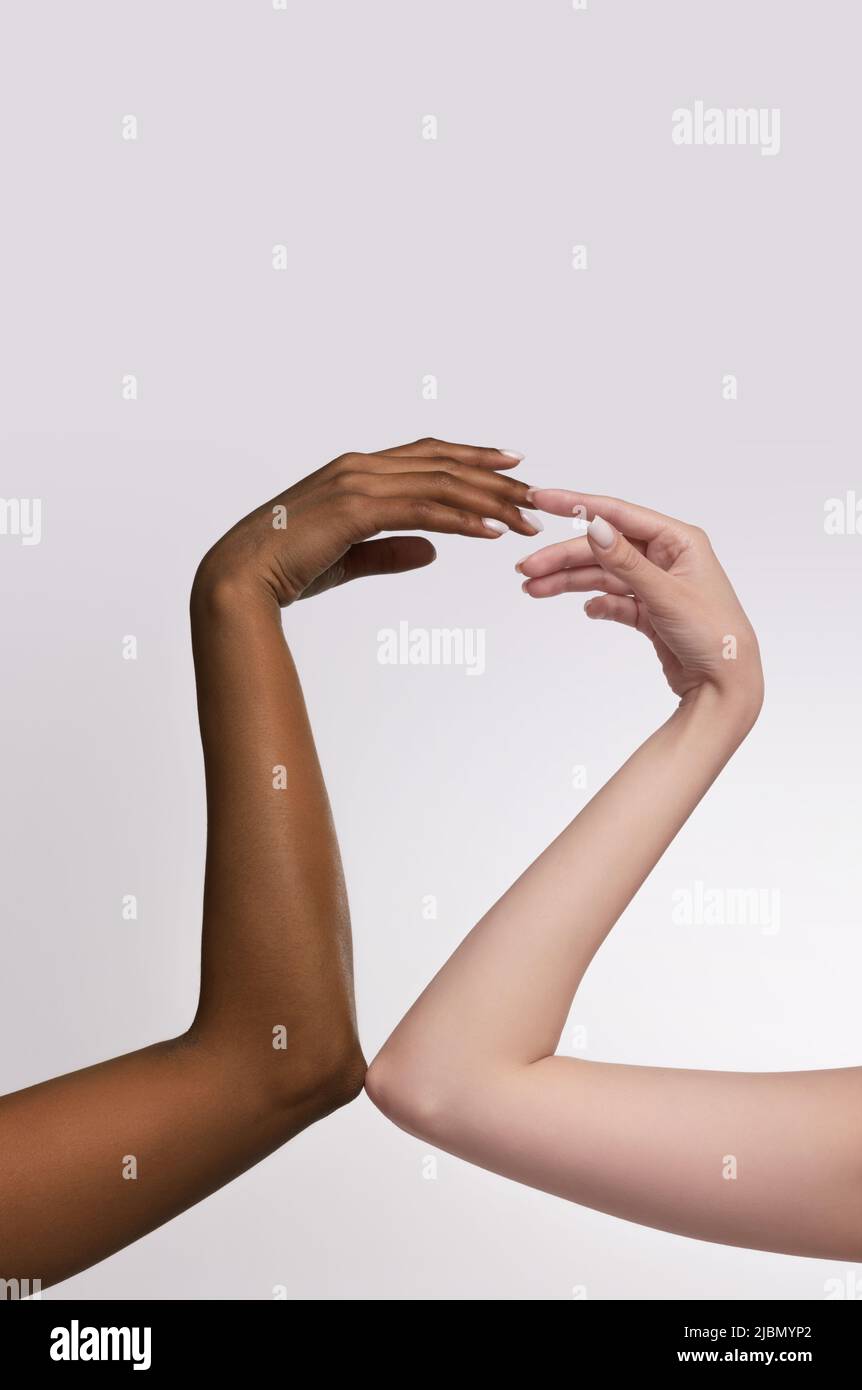 Plexus of female hands. Graceful female hands touch each other isolated ...