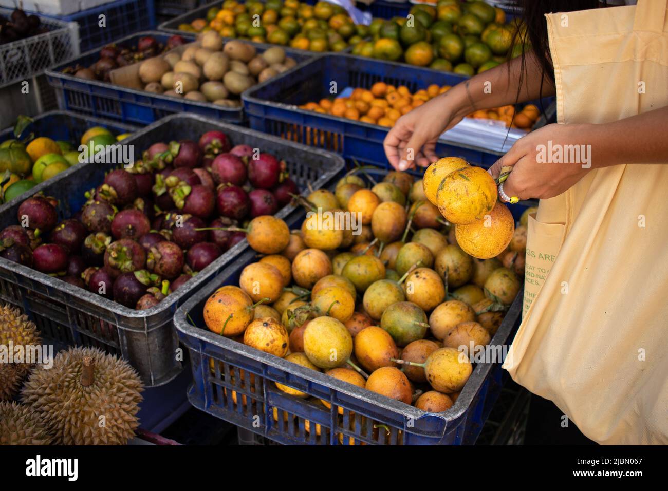Shopping at Bali fruit market Stock Photo - Alamy