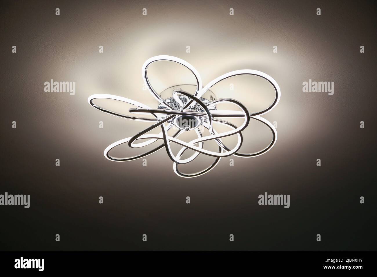 Modern LED chandelier on the ceiling Stock Photo - Alamy