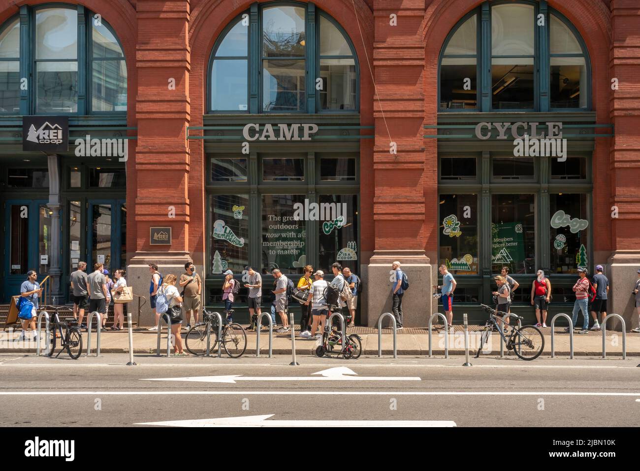 Line to enter the REI sporting goods store in Soho in New York on ...