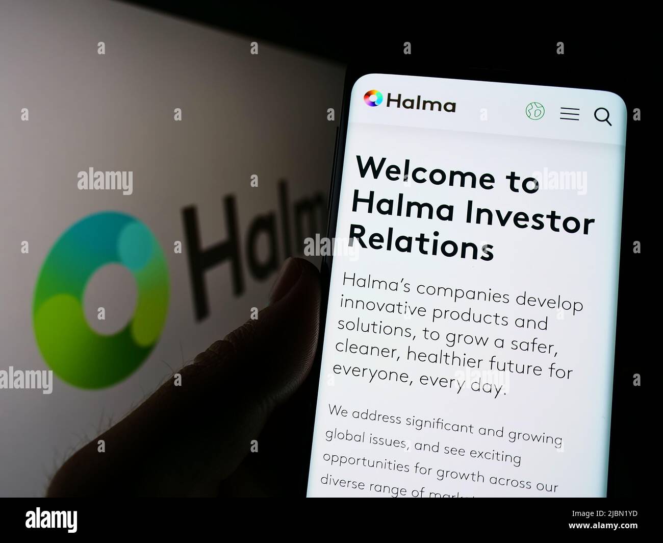 Person holding cellphone with webpage of British safety equipment ...