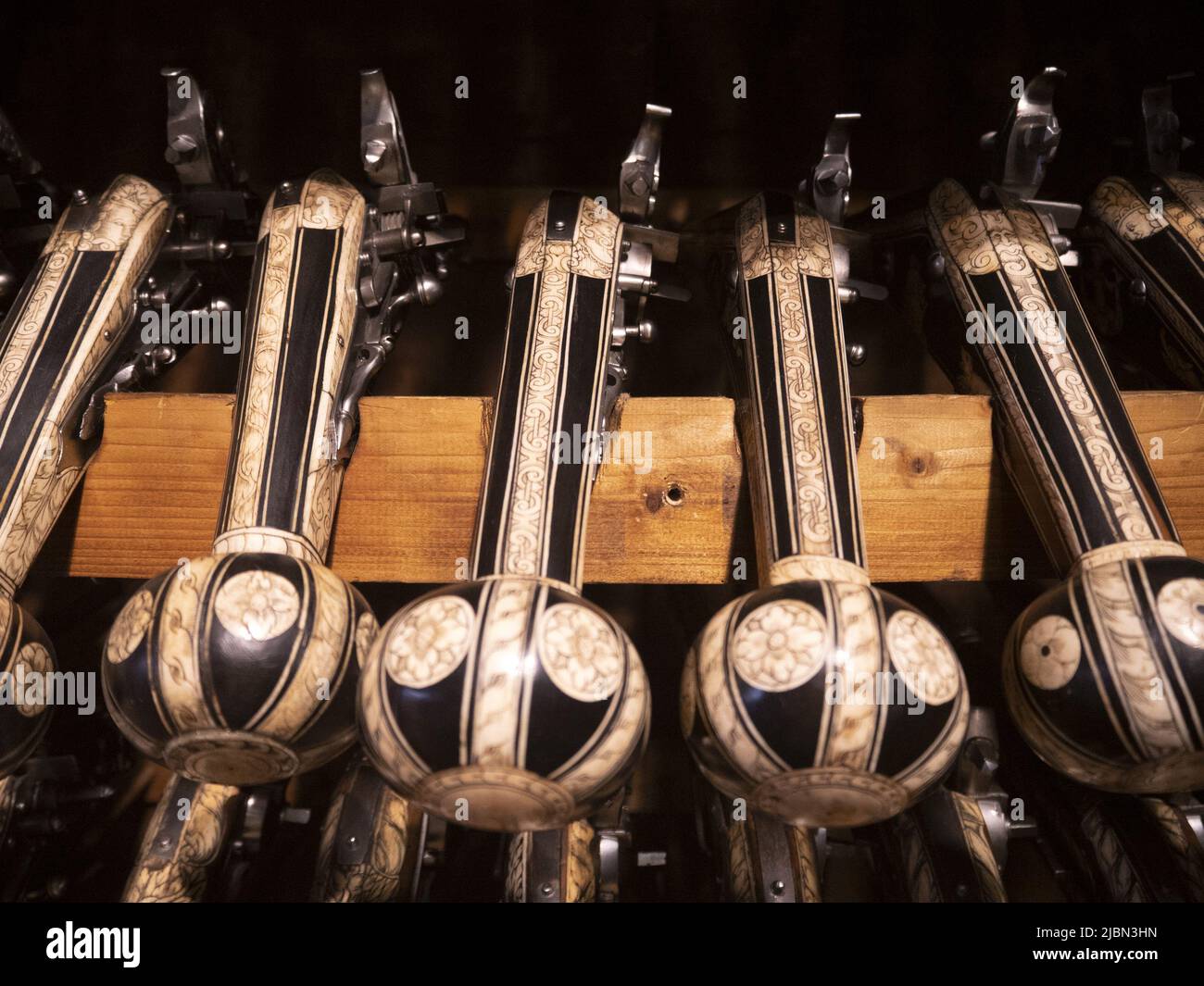 many medieval iron wood pistols guns detail Stock Photo - Alamy