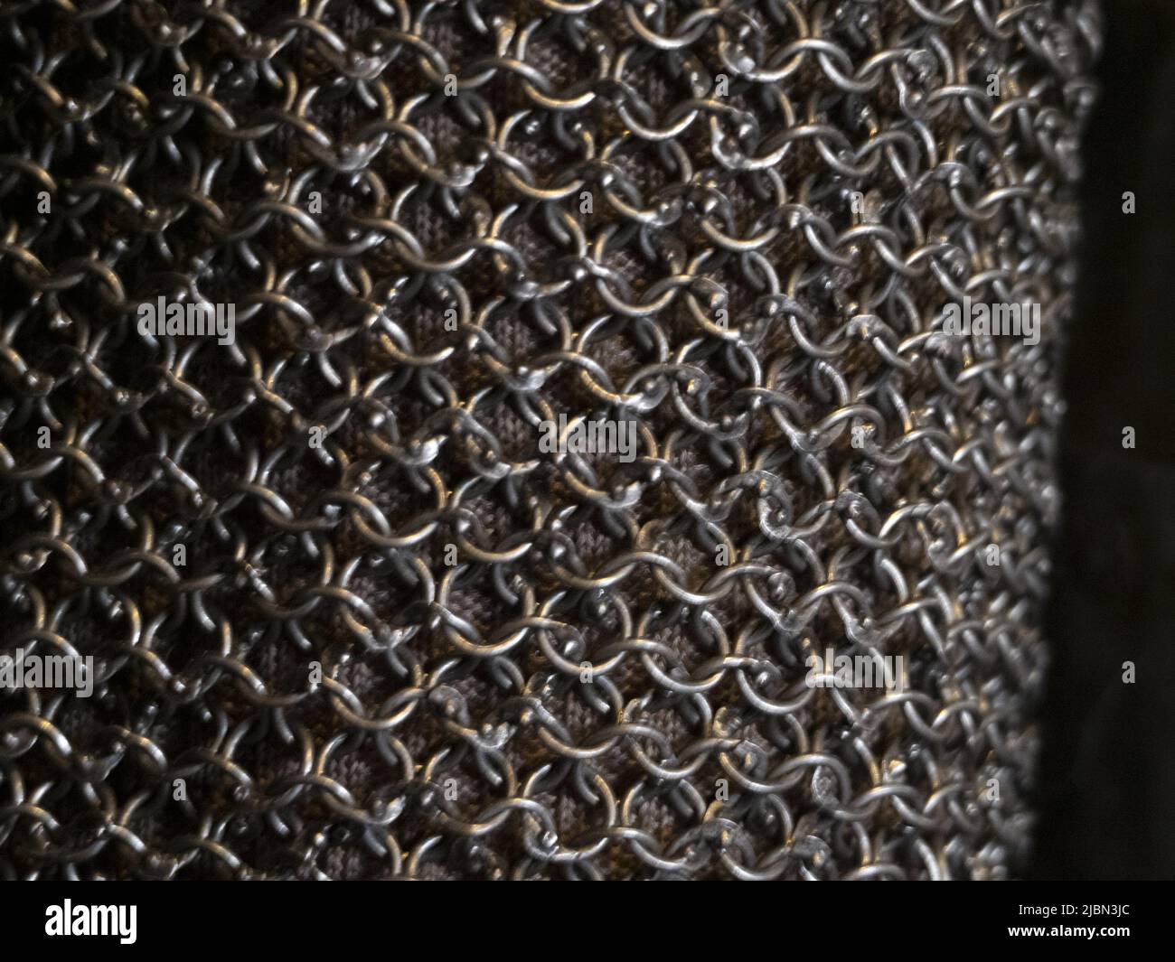many medieval chain iron metal armors detail Stock Photo - Alamy
