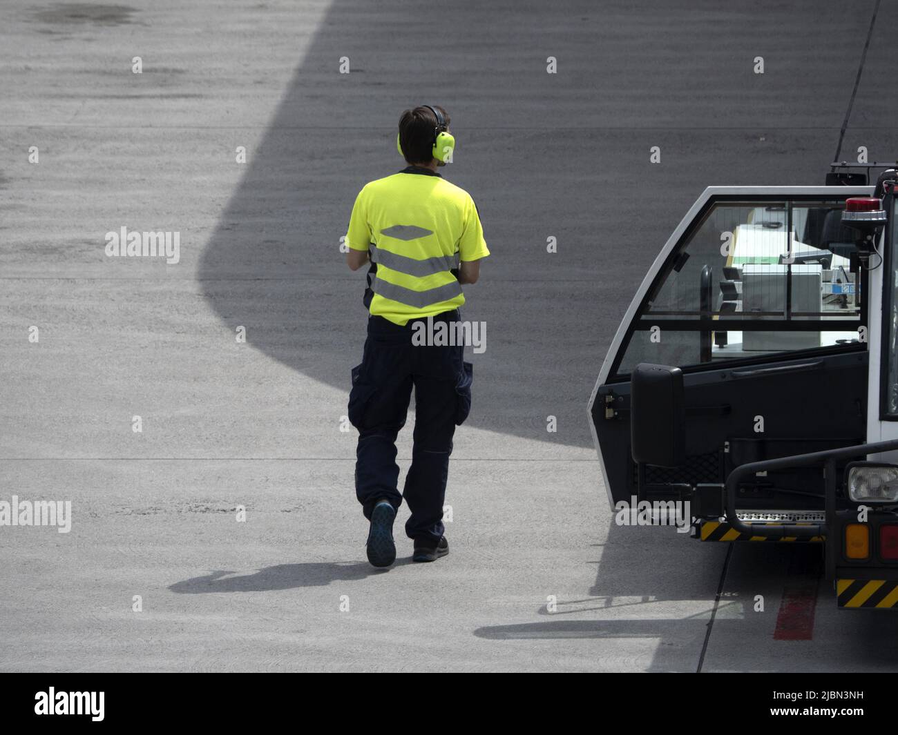 Airport airplane inspector checking detail Stock Photo - Alamy